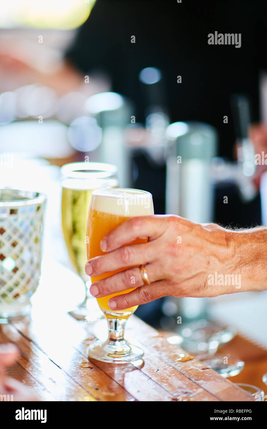 man preparing alcoholic drinks at bar Stock Photo - Alamy