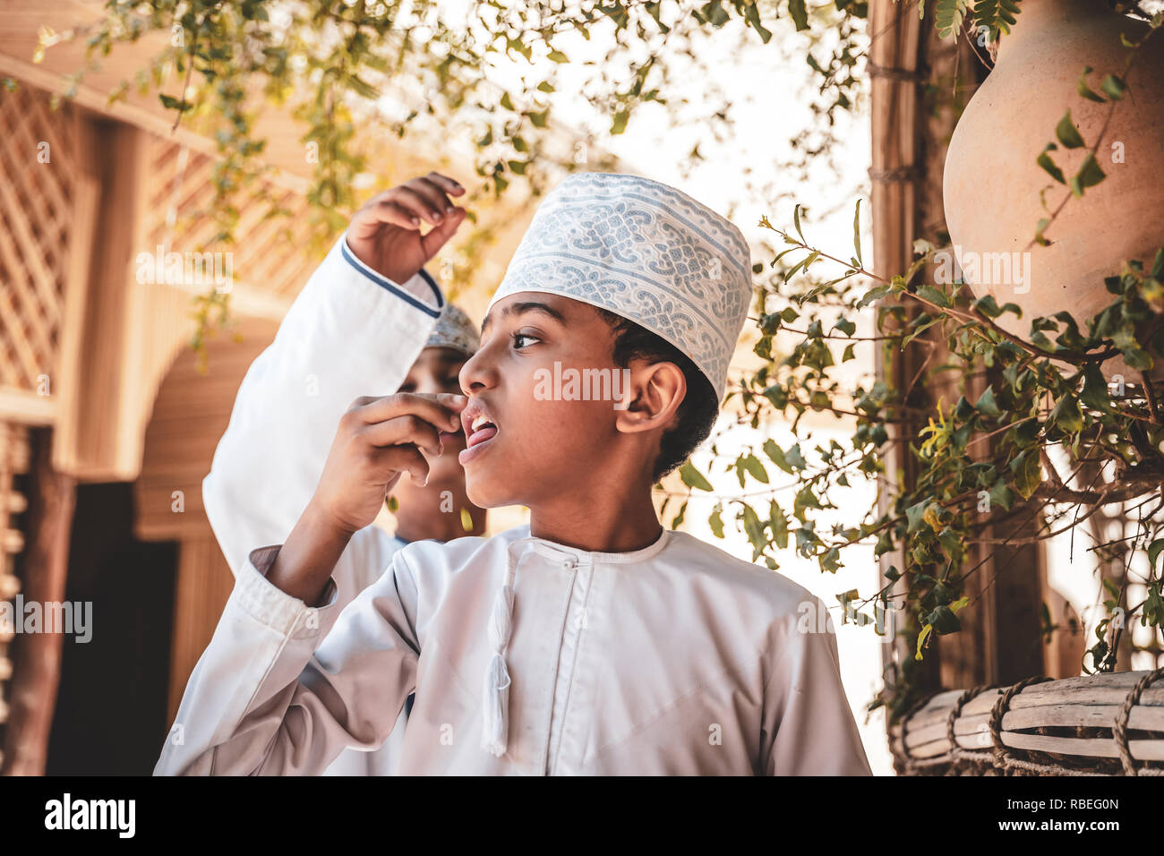 Candid portrait of a cute omani kid in Nizwa Stock Photo - Alamy