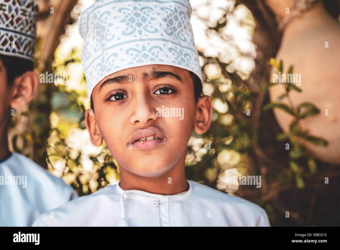 Candid portrait of a cute omani kid in Nizwa Stock Photo - Alamy