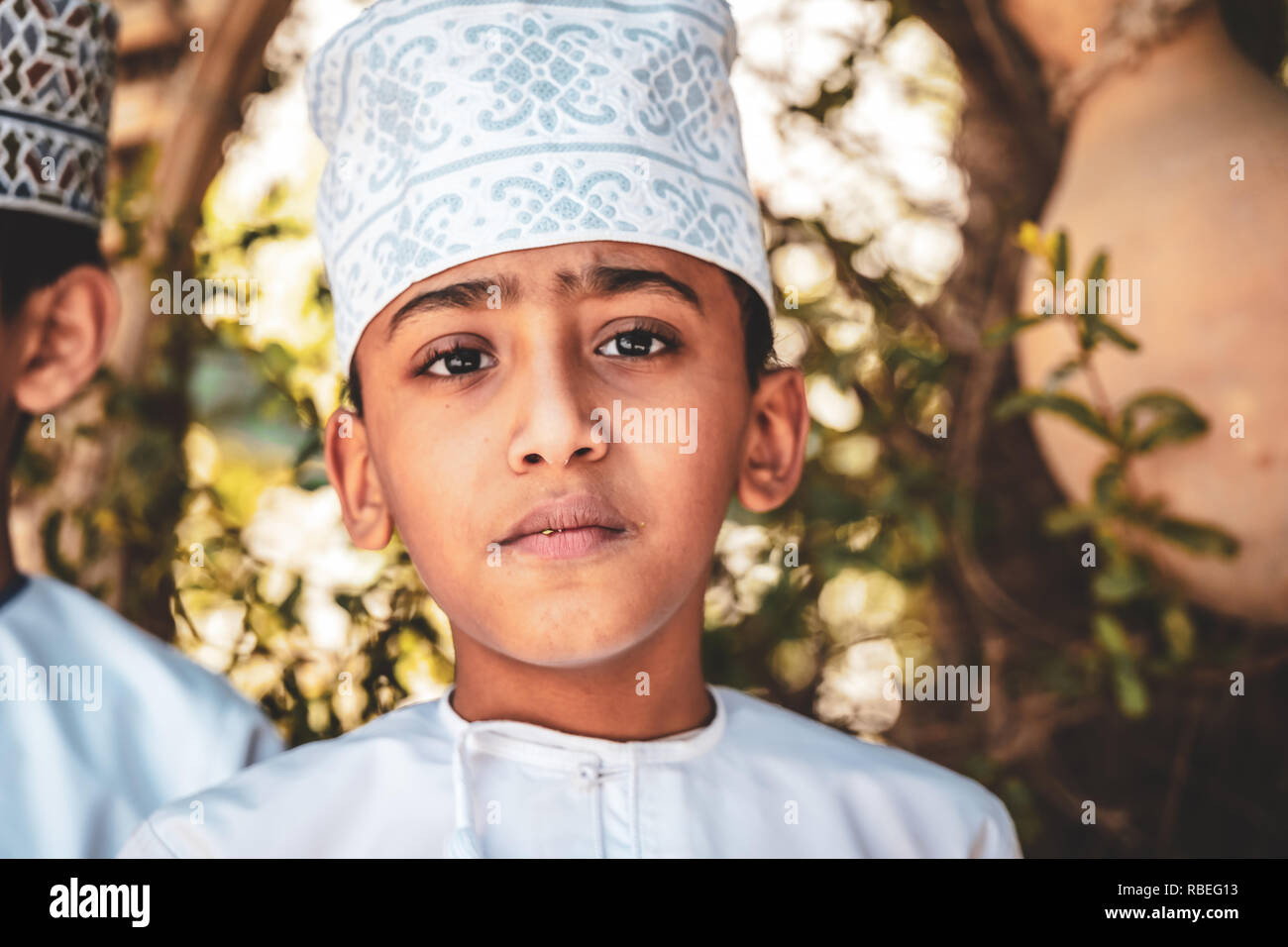 Candid portrait of a cute omani kid in Nizwa Stock Photo - Alamy