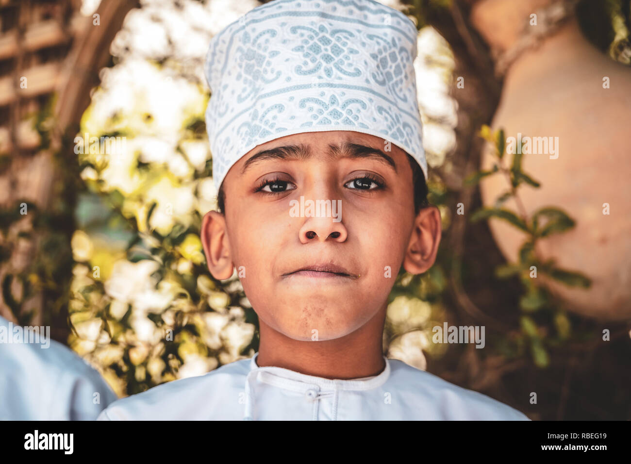 Candid portrait of a cute omani kid in Nizwa Stock Photo - Alamy