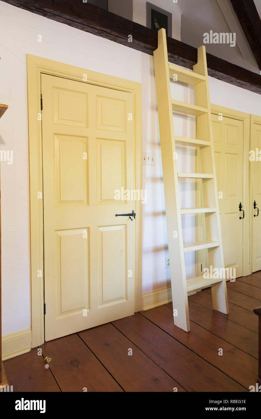 Old wooden ladder leading to the attic in the master bedroom on the ...