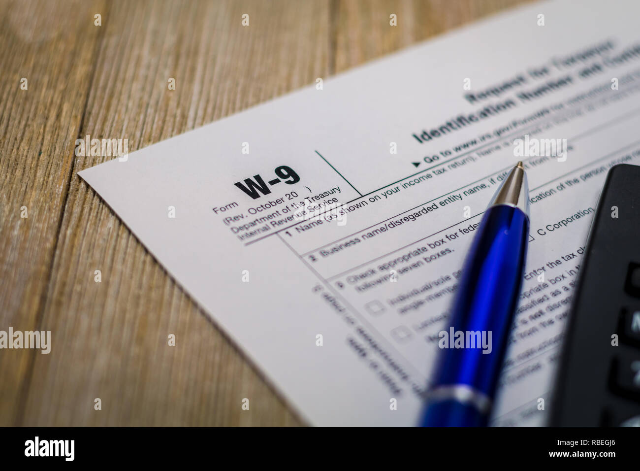 Tax forms still life business finance concept, form W9, with calculator ...