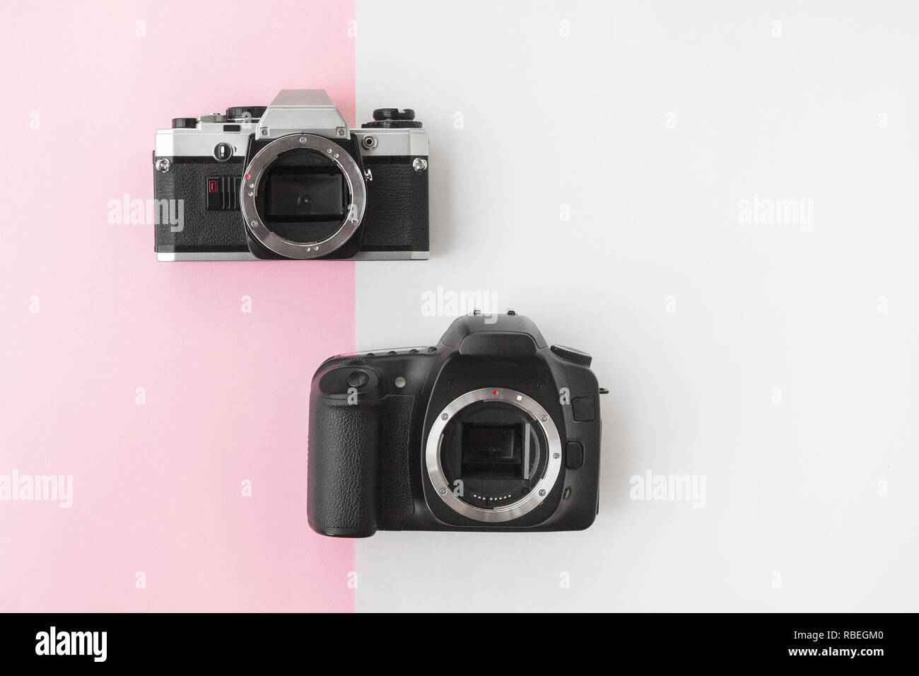 Digital versus Analog SLR Camera on Pink Back with Copyspace Stock ...