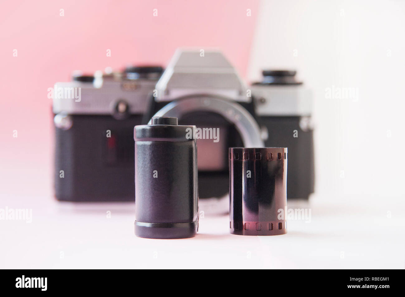 35 mm Film Canister with Negative on Blurry SLR Camera Background Stock ...