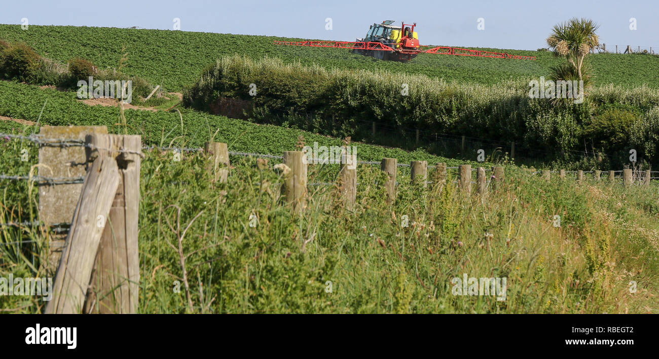 Crop spraying on slope hi-res stock photography and images - Alamy