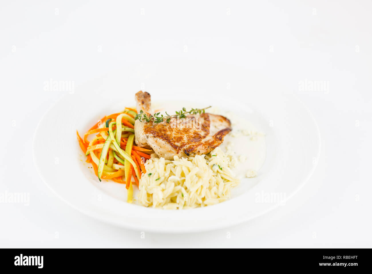 Grilled chicken plated dinner Stock Photo - Alamy