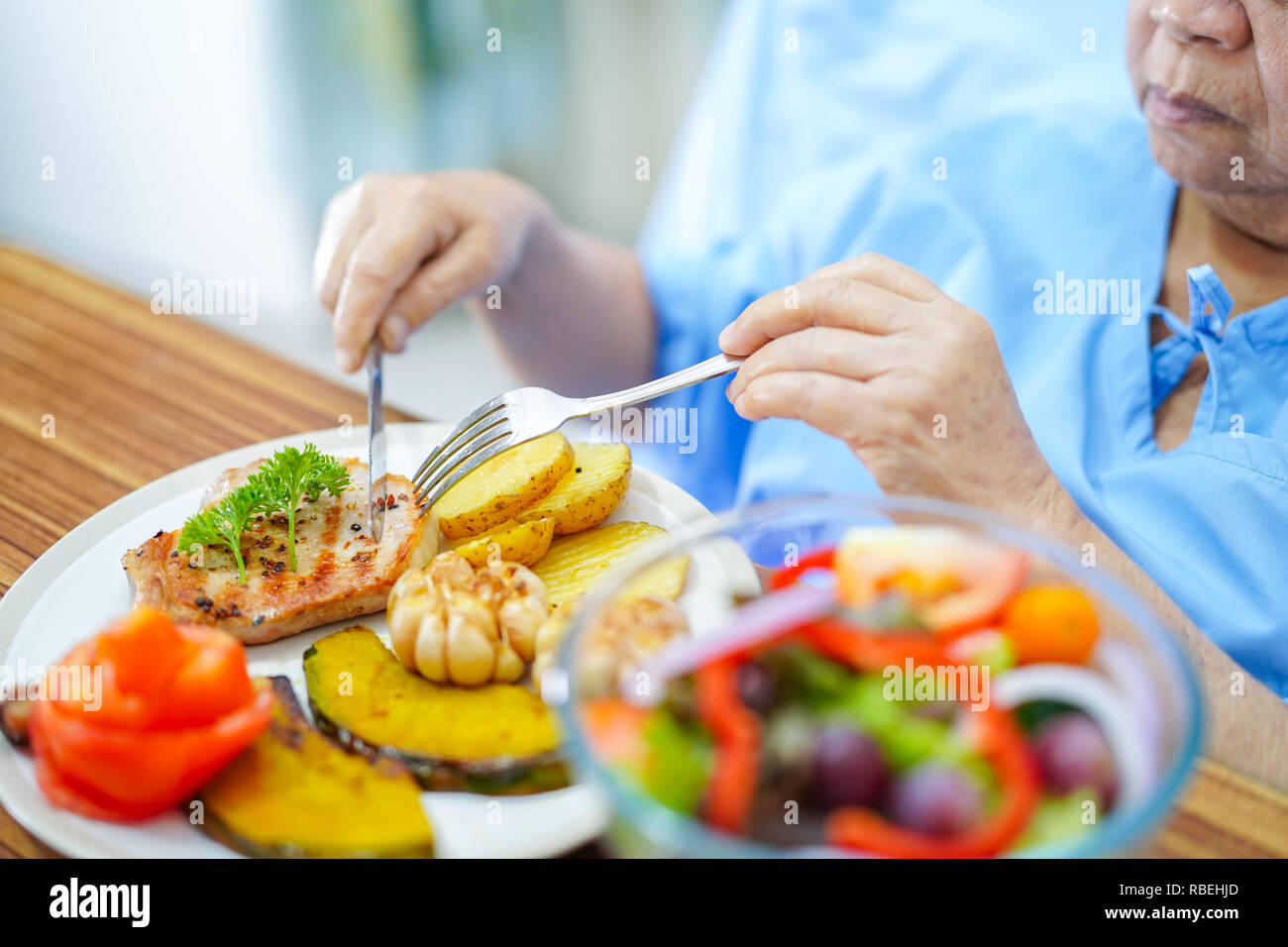 Asian senior old lady woman patient eating breakfast healthy food in ...