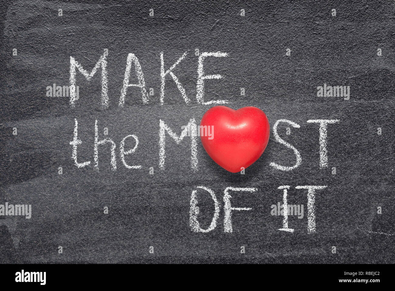 make most of it phrase handwritten on chalkboard with red heart symbol ...
