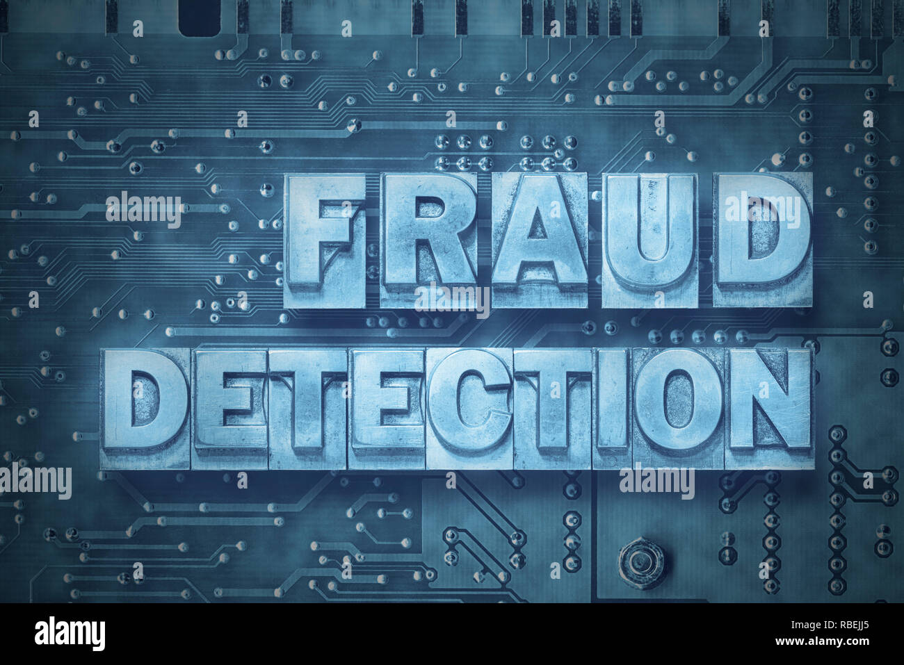 fraud detection phrase made from metallic letterpress blocks on the pc ...