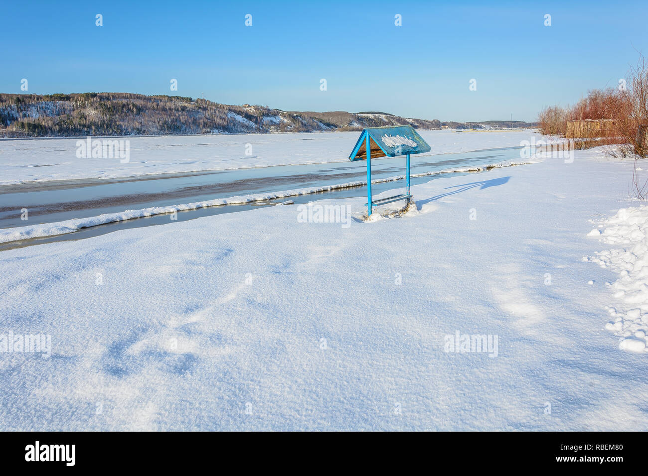 The river beach is flooded in the spring with melted snow and ice Stock ...