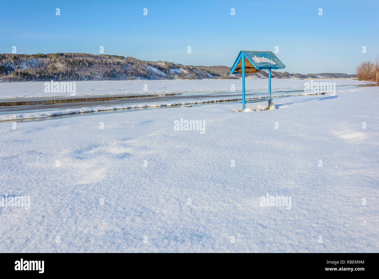The river beach is flooded in the spring with melted snow and ice Stock ...