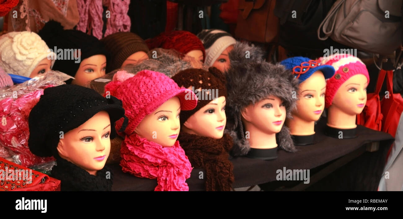 row of puppet heads with a variety of hats on a market Stock Photo - Alamy