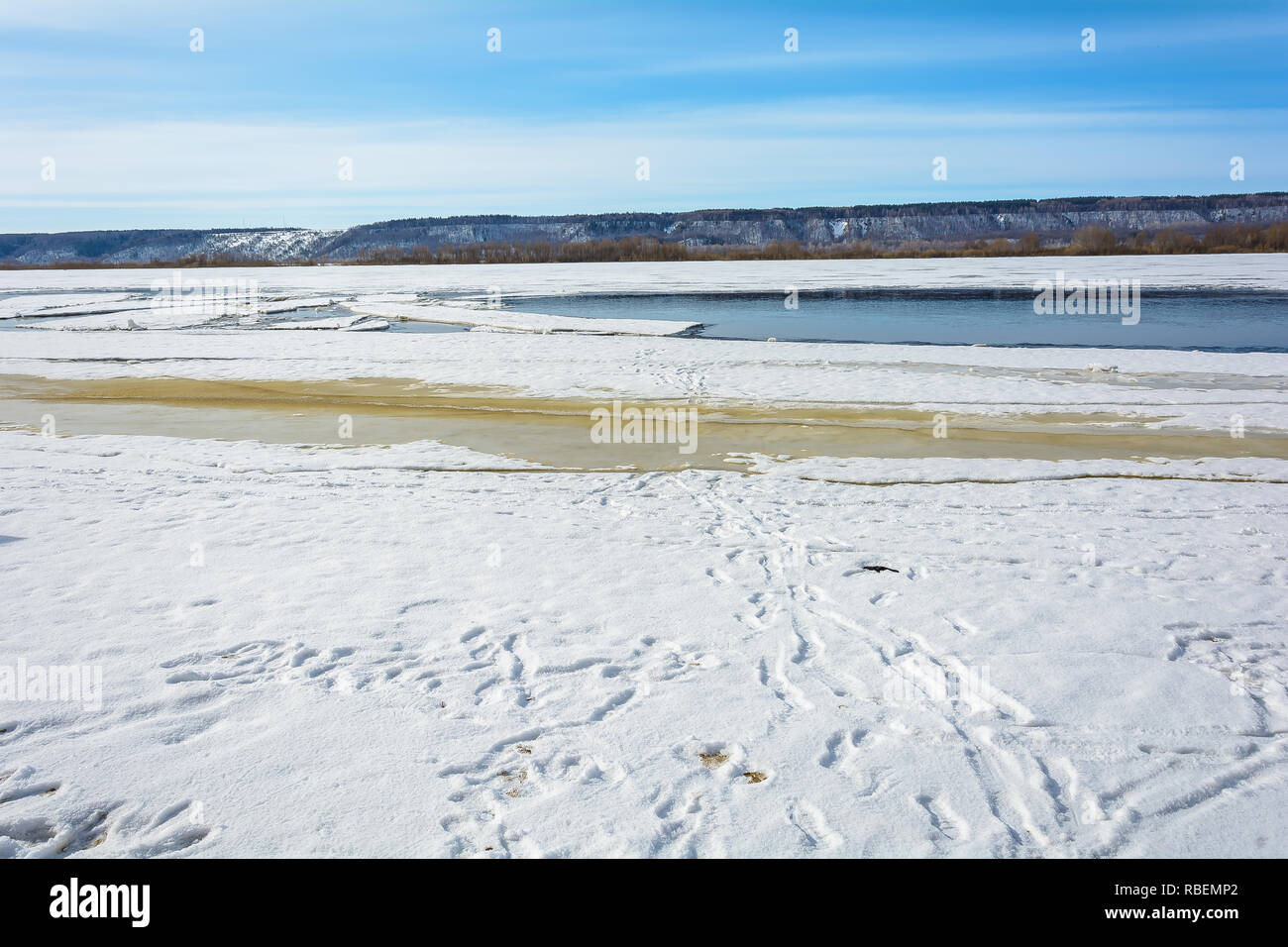 The river beach is flooded in the spring with melted snow and ice Stock ...