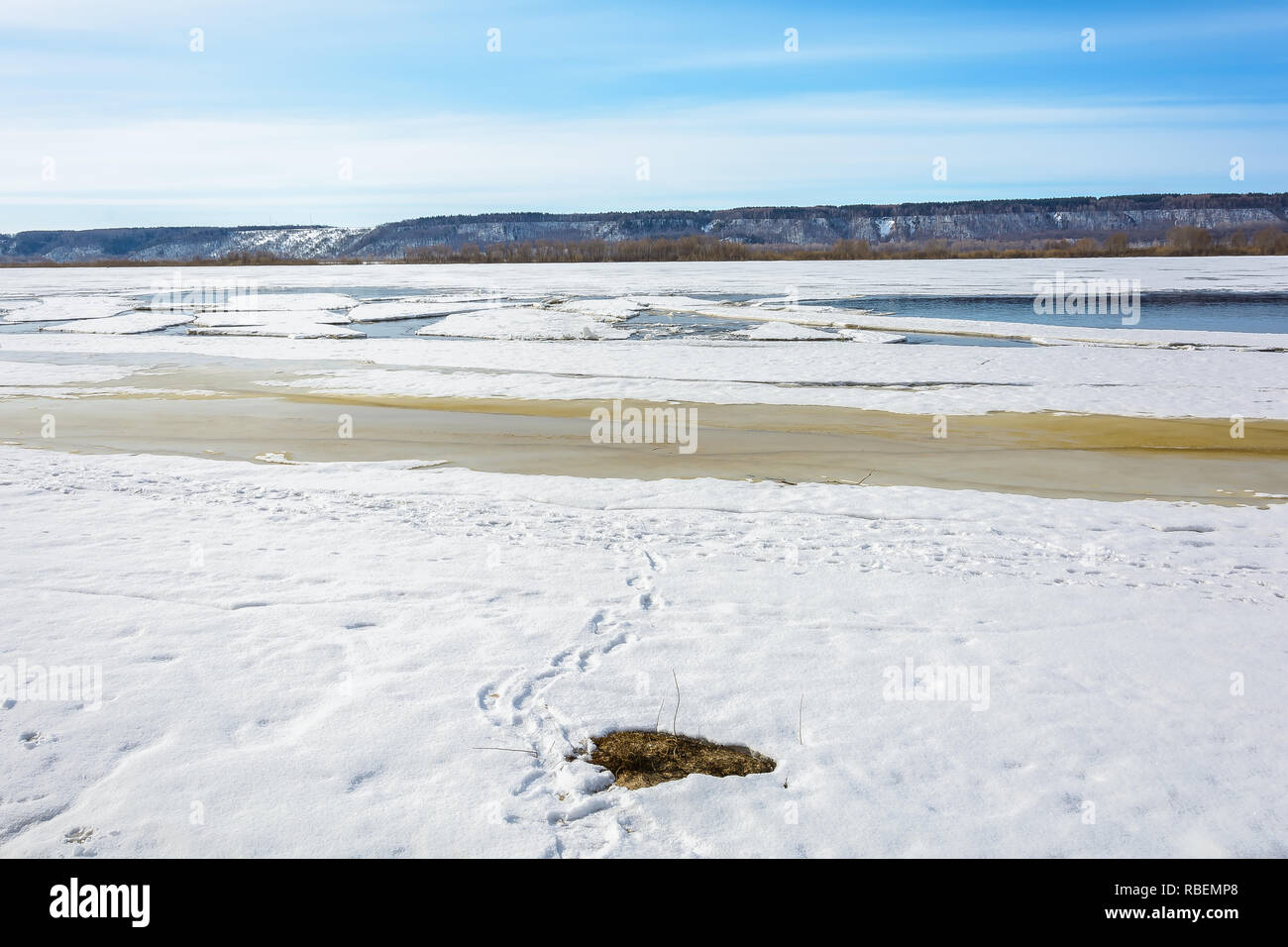 The river beach is flooded in the spring with melted snow and ice Stock ...