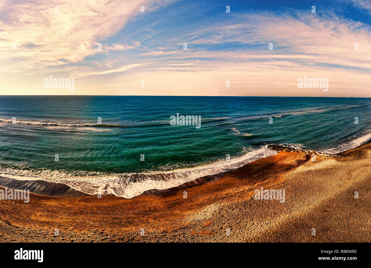 Panorama seascape view above the ocean with sand water and scenic sky ...