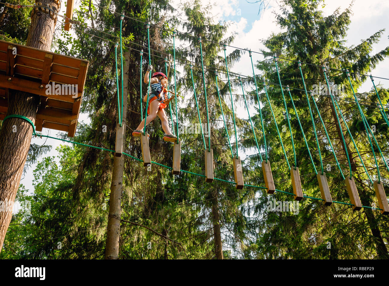 Girl up ladder tree hi-res stock photography and images - Alamy