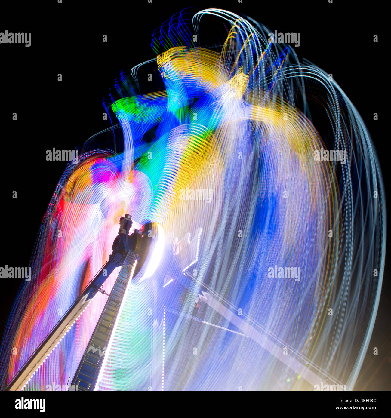 Long Exposure Of A Spinning Carnival Ride Stock Photo - Alamy
