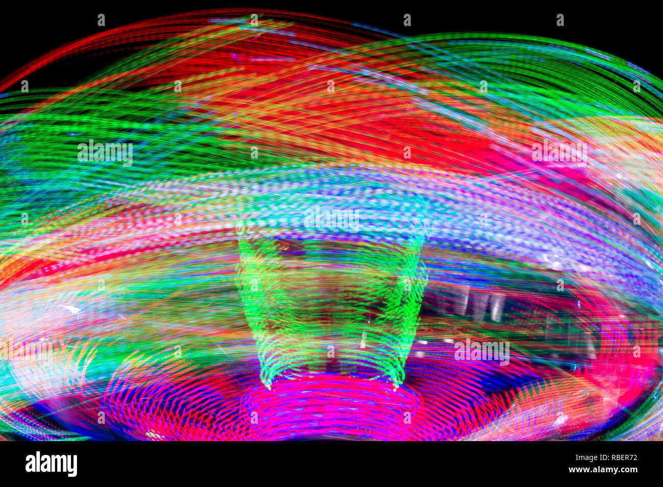 Long Exposure Of A Spinning Carnival Ride Stock Photo - Alamy