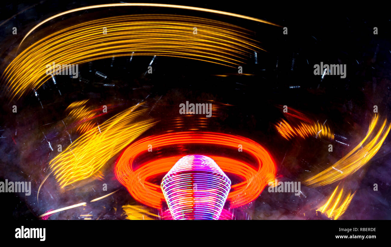 Long Exposure Of A Spinning Carnival Ride Stock Photo - Alamy