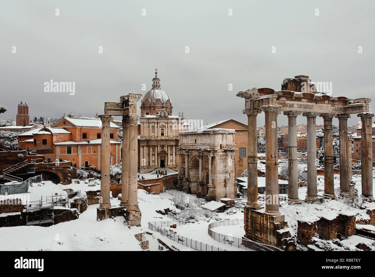 Winter in Rome. View of frozen Roman Forum ancient ruins and baroque ...