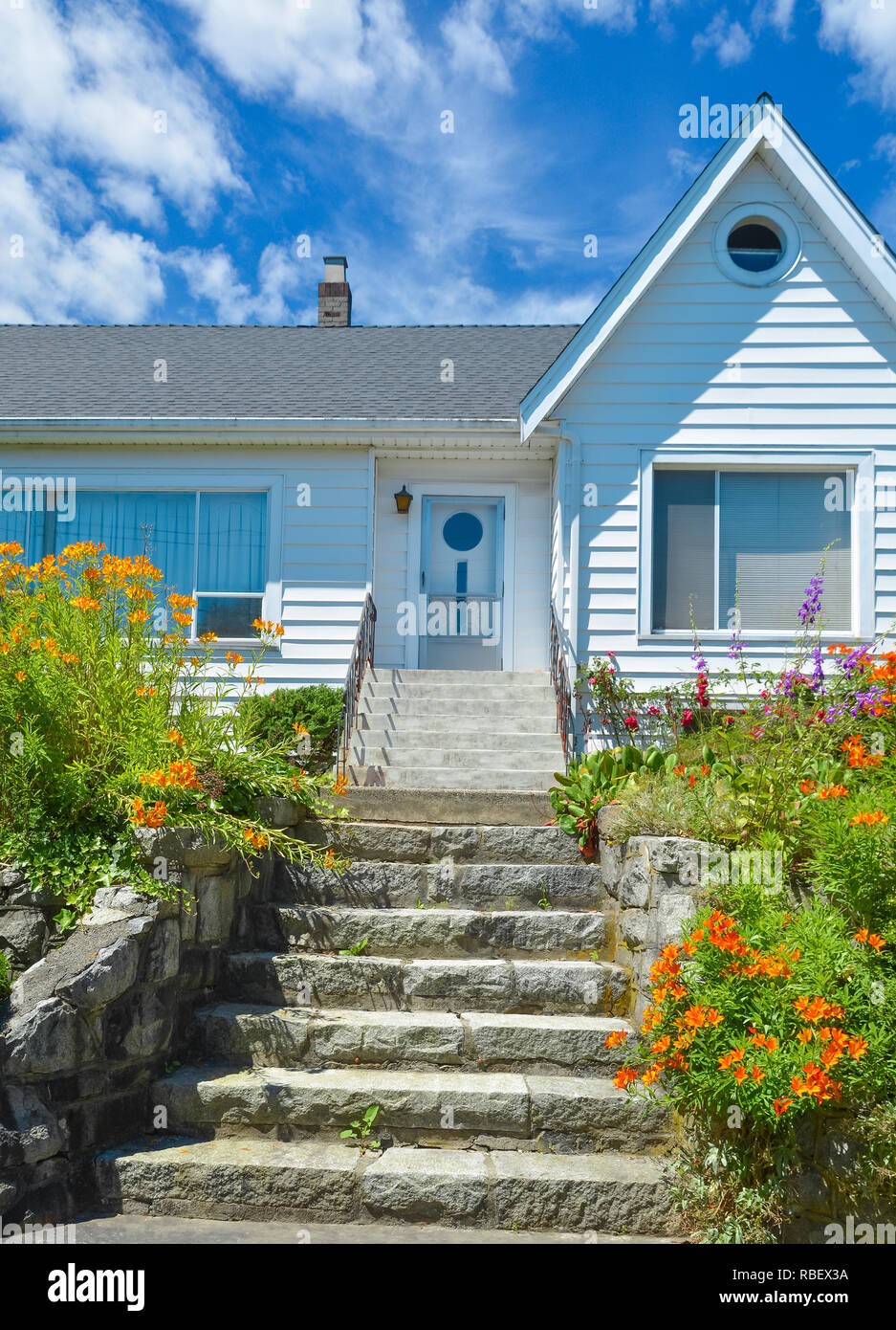 Main entrance of residential house with stone stairway. Family house on ...