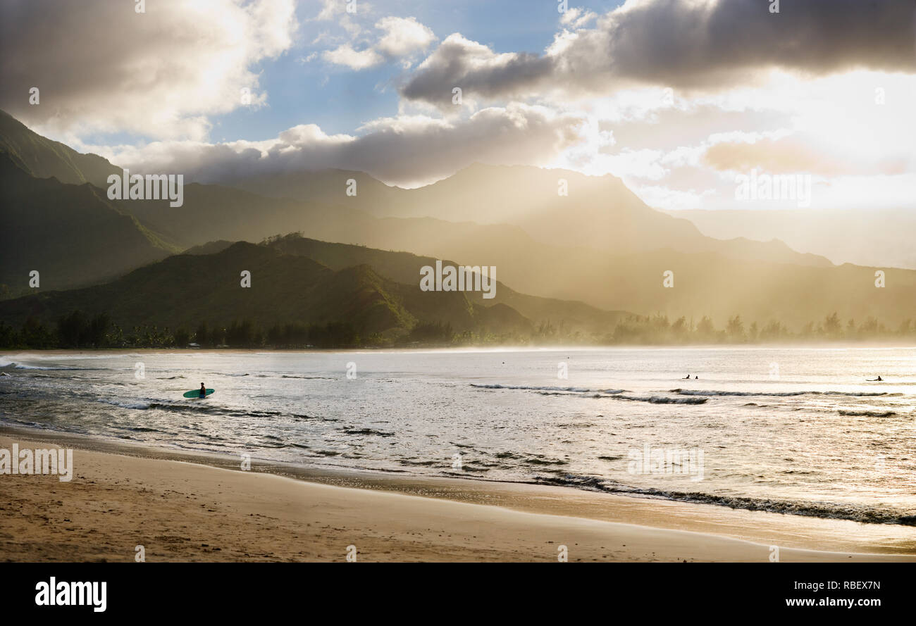Remote beach with mountains in the background Stock Photo - Alamy