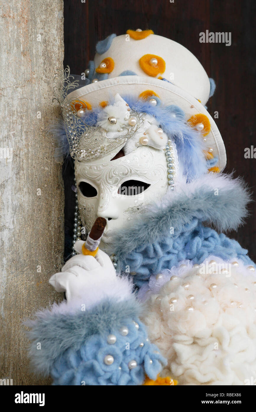 Beautiful venetian mask with cigar and tuba at St. Mark square during ...