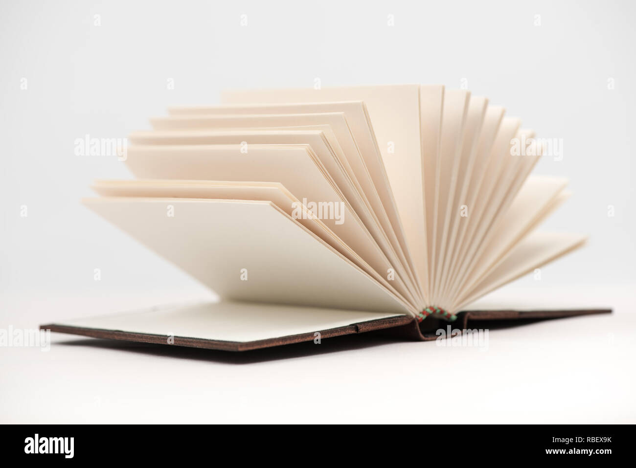 Open empty white book. Closeup of several pages from a book, view from ...
