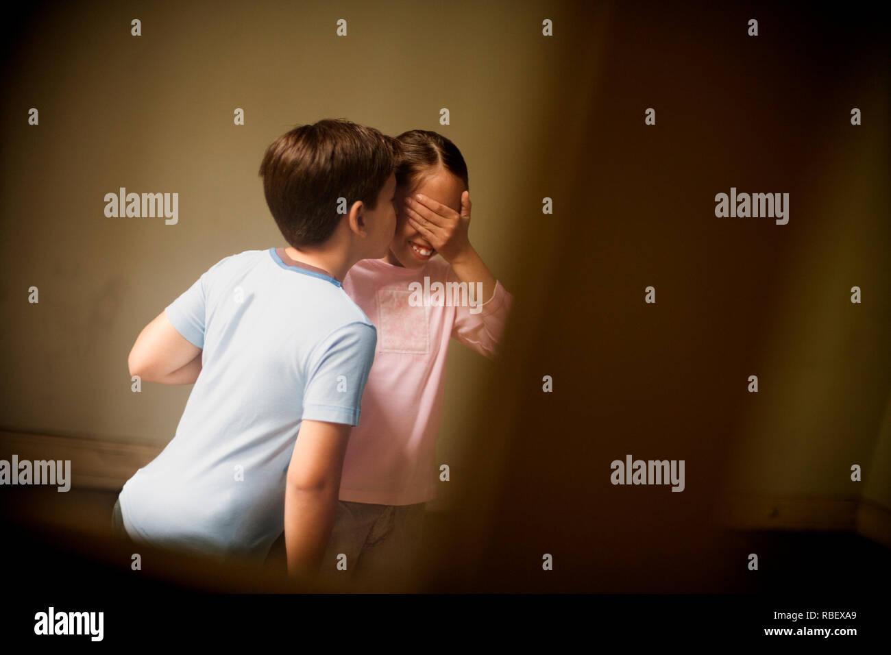 A small boy is kissing a shy small girl Stock Photo - Alamy