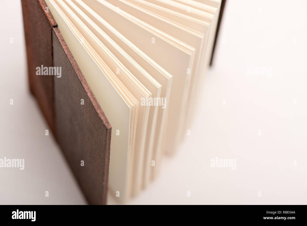 Open empty white book. Closeup of several pages from a book, view from ...