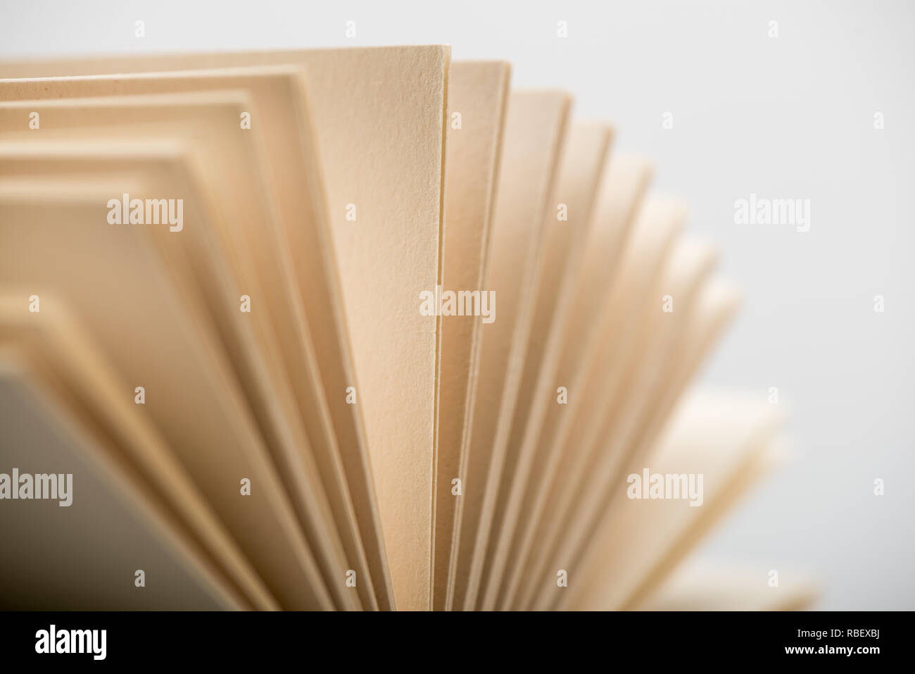 Open empty white book. Closeup of several pages from a book, view from ...