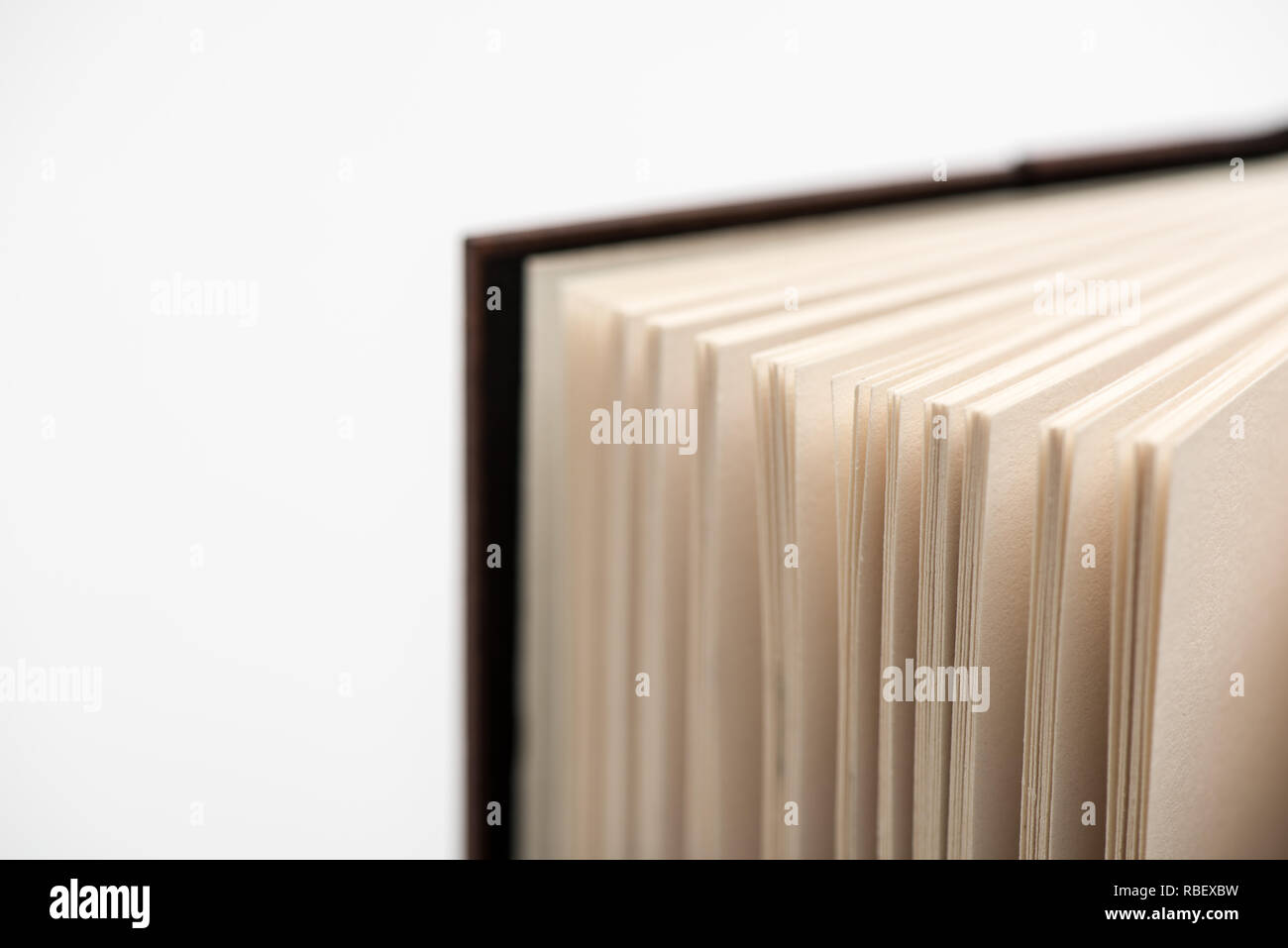 Open empty white book. Closeup of several pages from a book, view from ...
