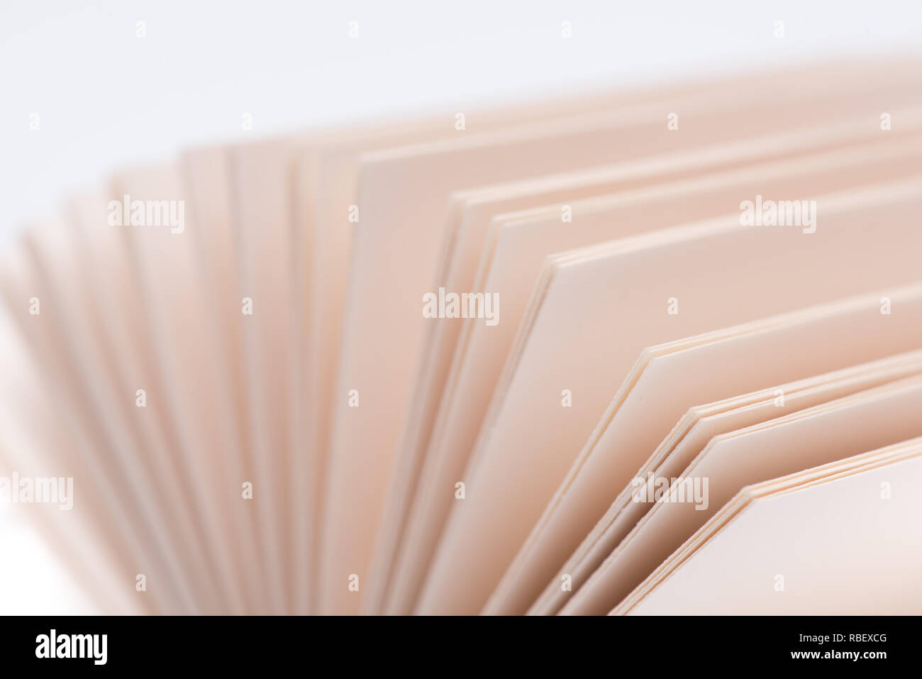 Open empty white book. Closeup of several pages from a book, view from ...