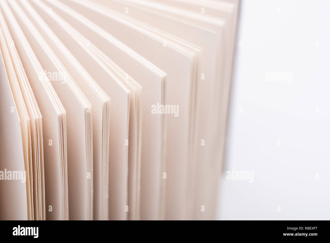 Open empty white book. Closeup of several pages from a book, view from ...