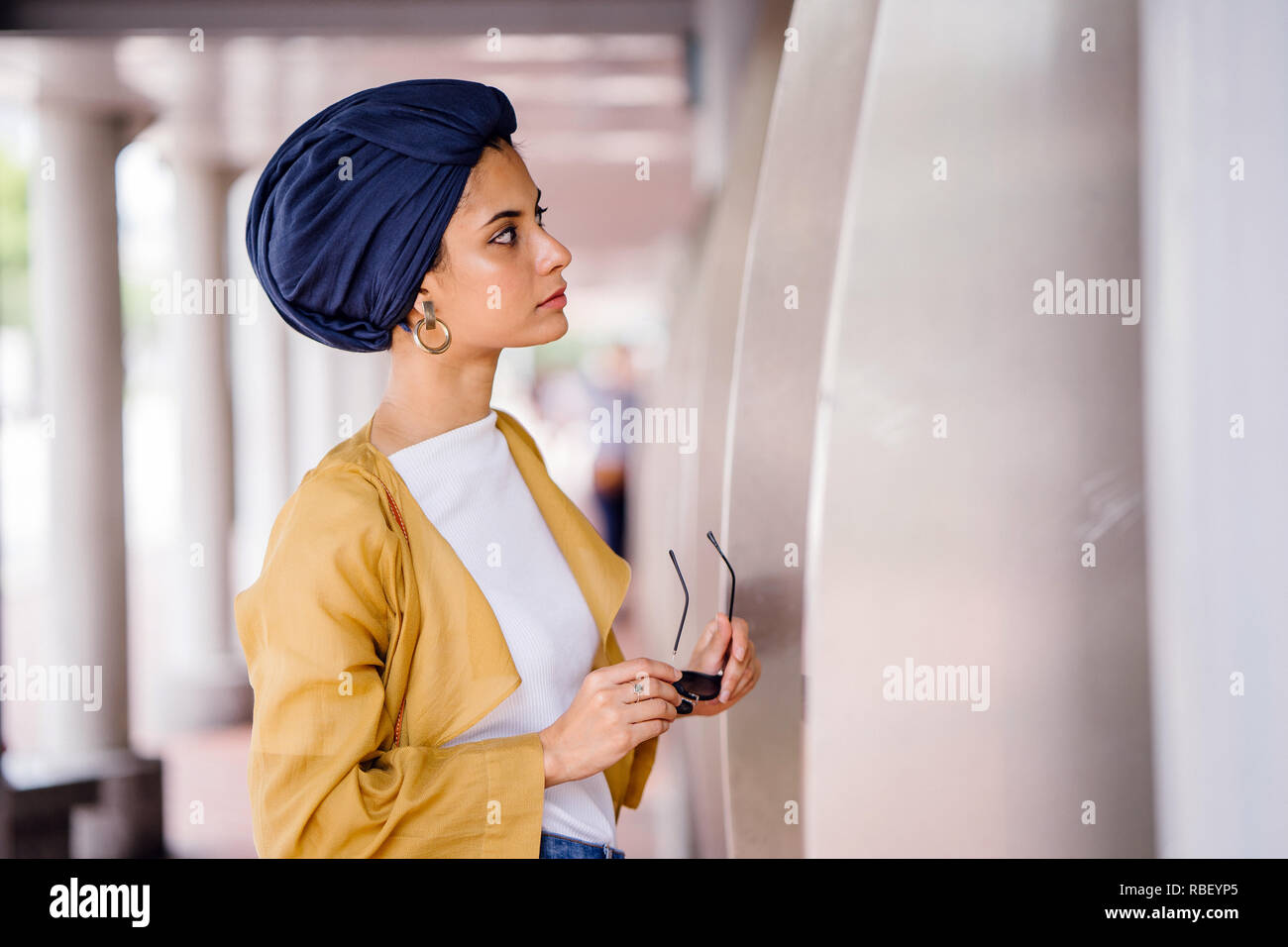 A young Muslim Asian woman of Middle Eastern descent in a stylish ...