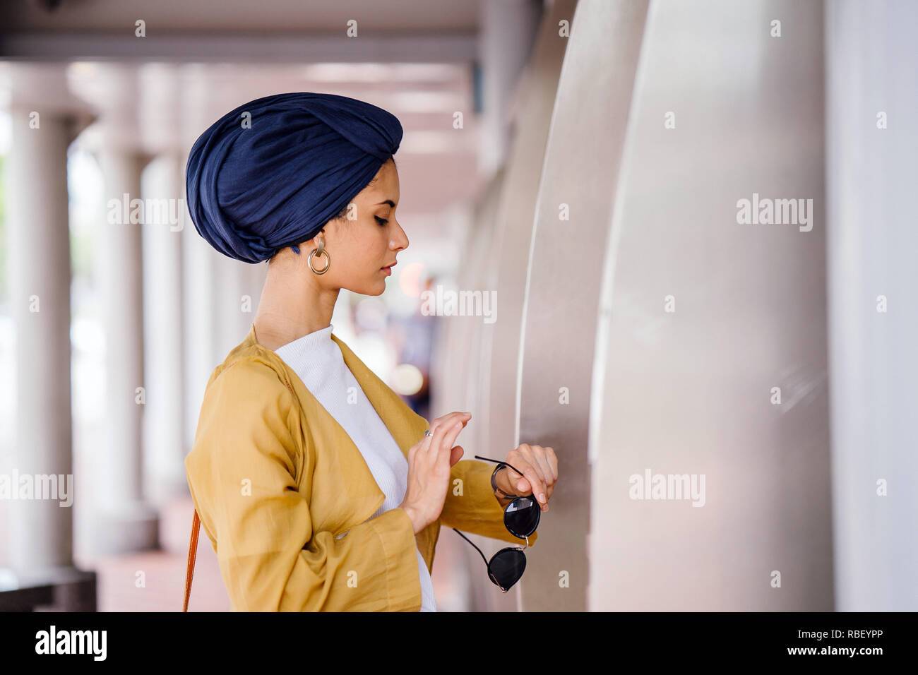 A young Muslim Asian woman of Middle Eastern descent in a stylish ...
