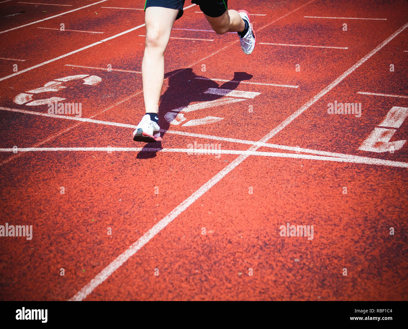athlete on running track Stock Photo - Alamy