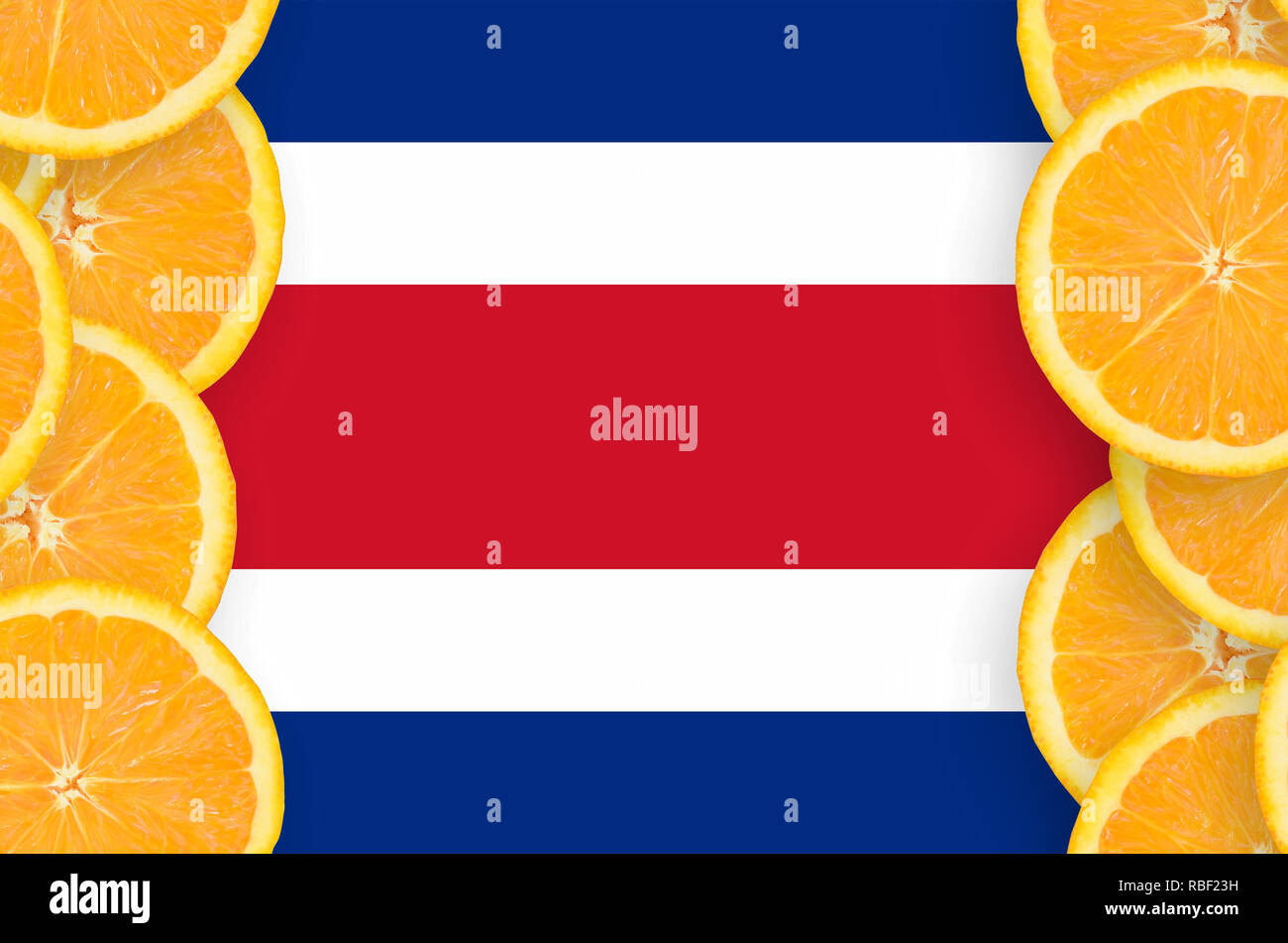 Costa Rica flag in vertical frame of orange citrus fruit slices ...