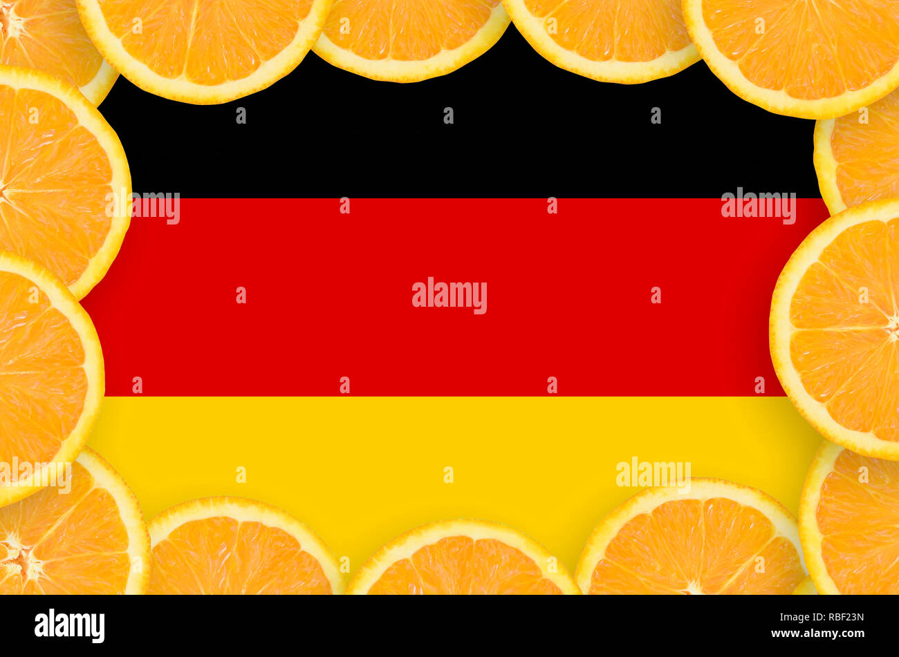 Germany flag in frame of orange citrus fruit slices. Concept of growing ...