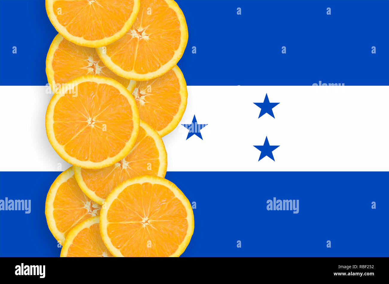 Honduras flag and vertical row of orange citrus fruit slices. Concept ...