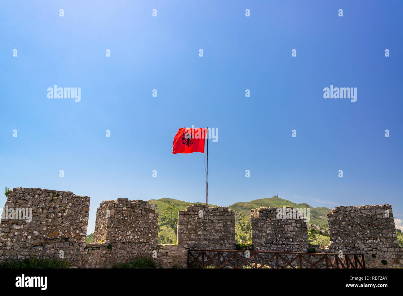 Albanian flag flying above Rozafa Castle in Shkoder, Albania Stock ...