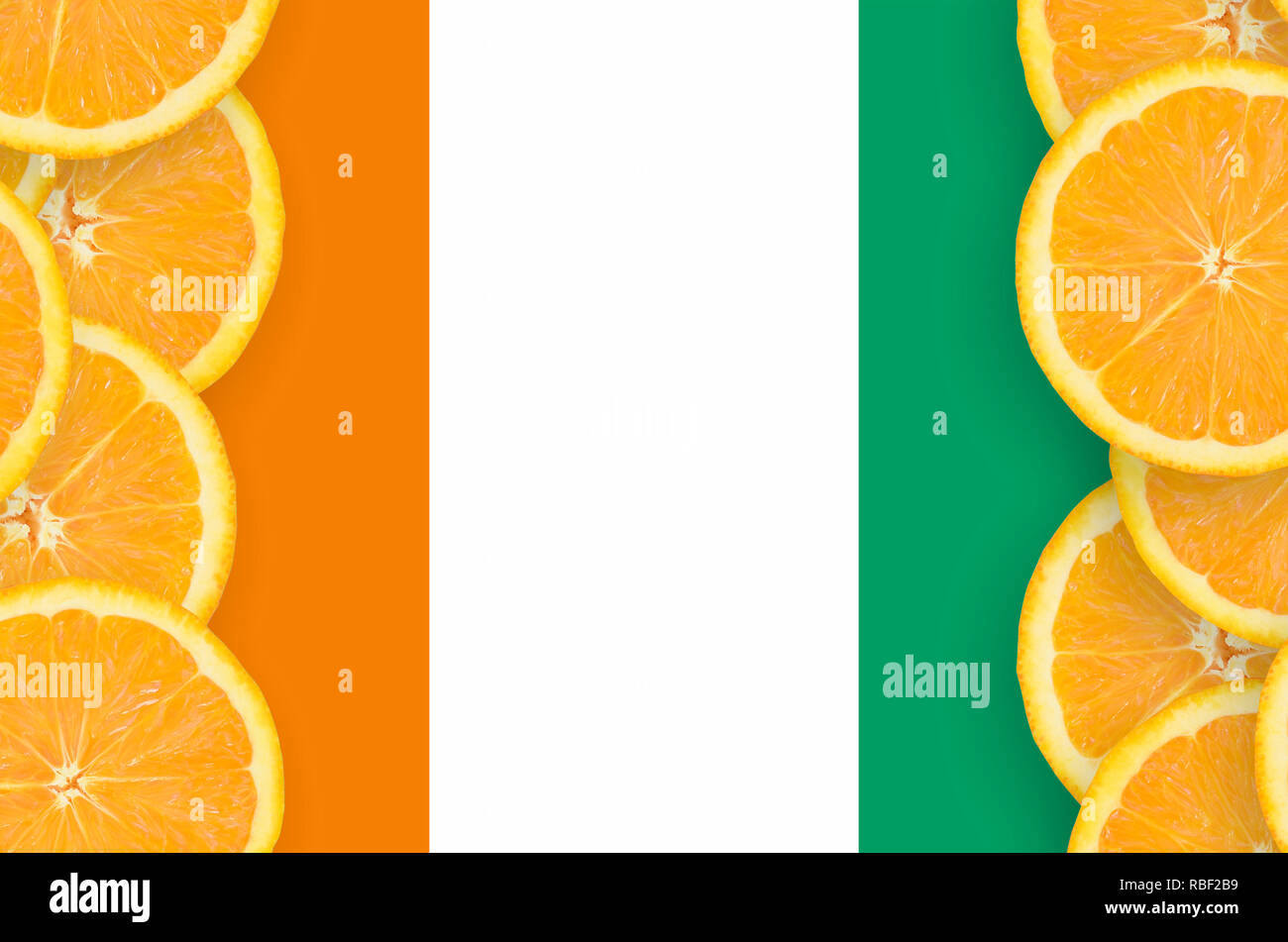 Ivory Coast flag in vertical frame of orange citrus fruit slices ...