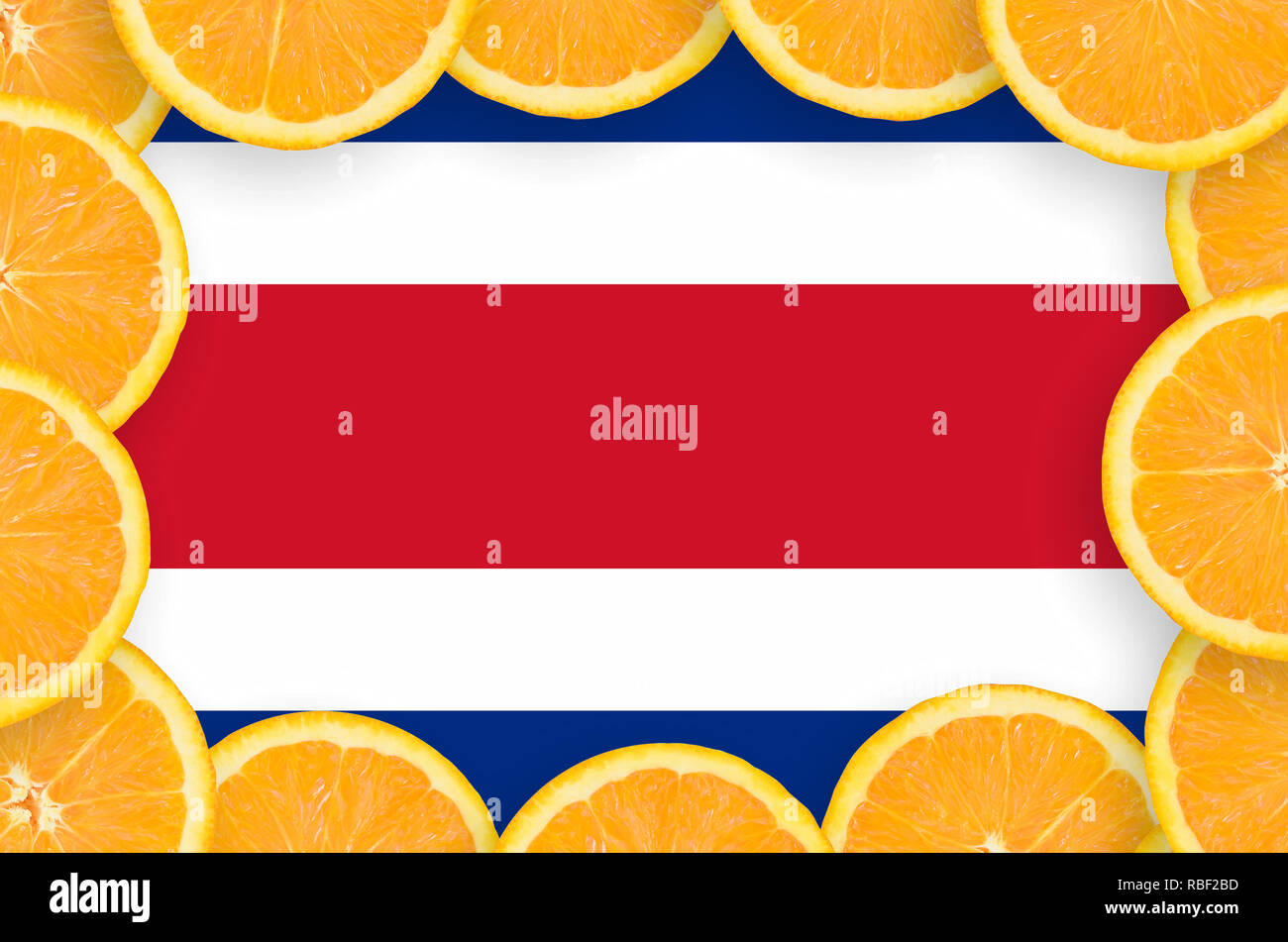 Costa Rica flag in frame of orange citrus fruit slices. Concept of ...