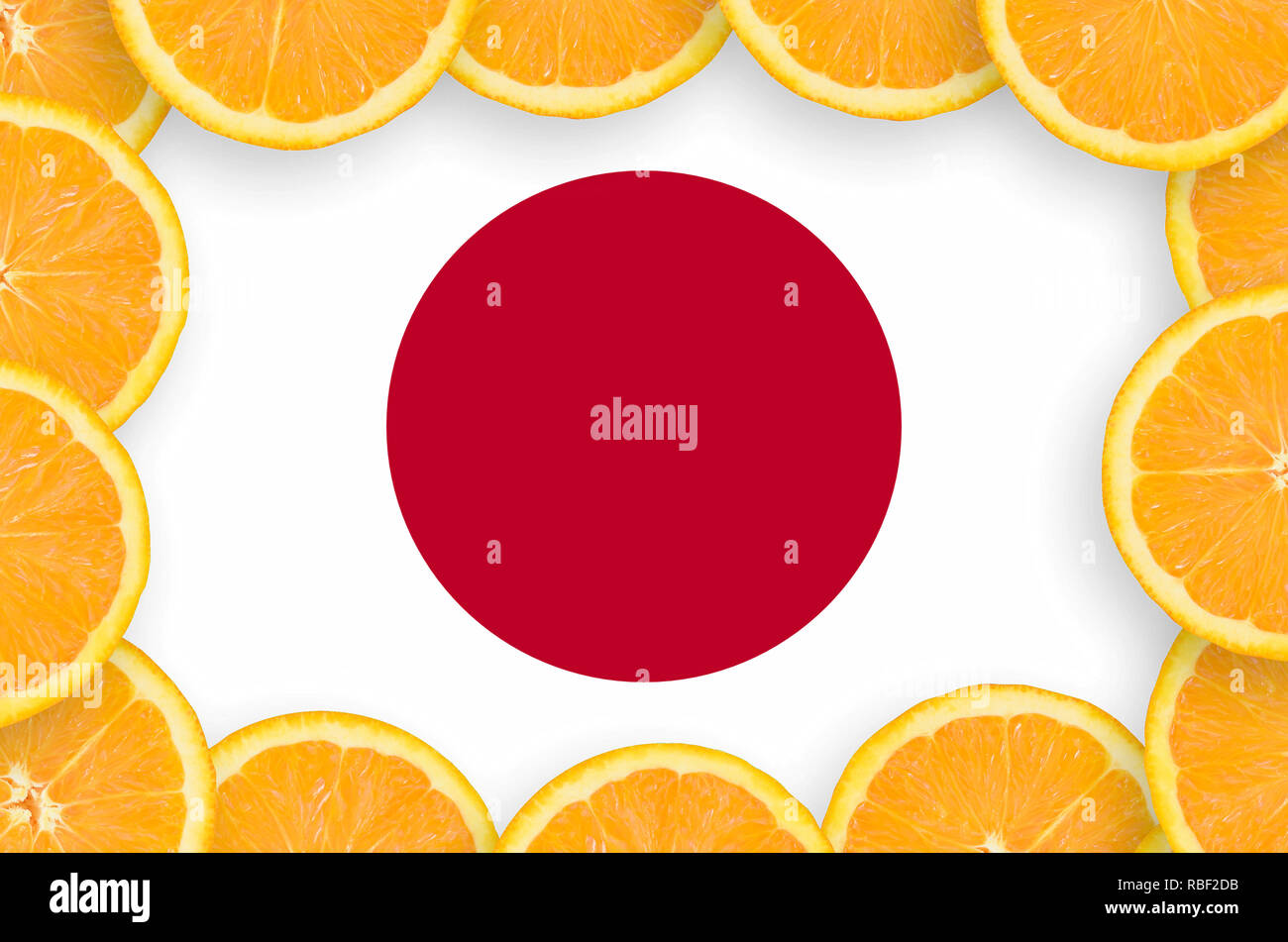 Japan flag in frame of orange citrus fruit slices. Concept of growing ...