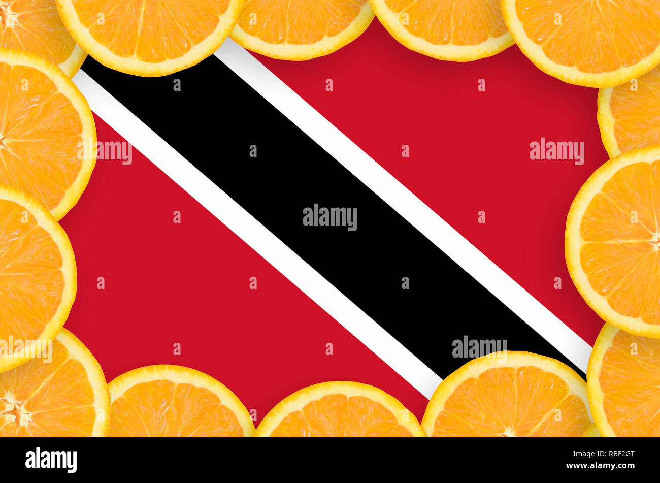 Trinidad and Tobago flag in frame of orange citrus fruit slices ...