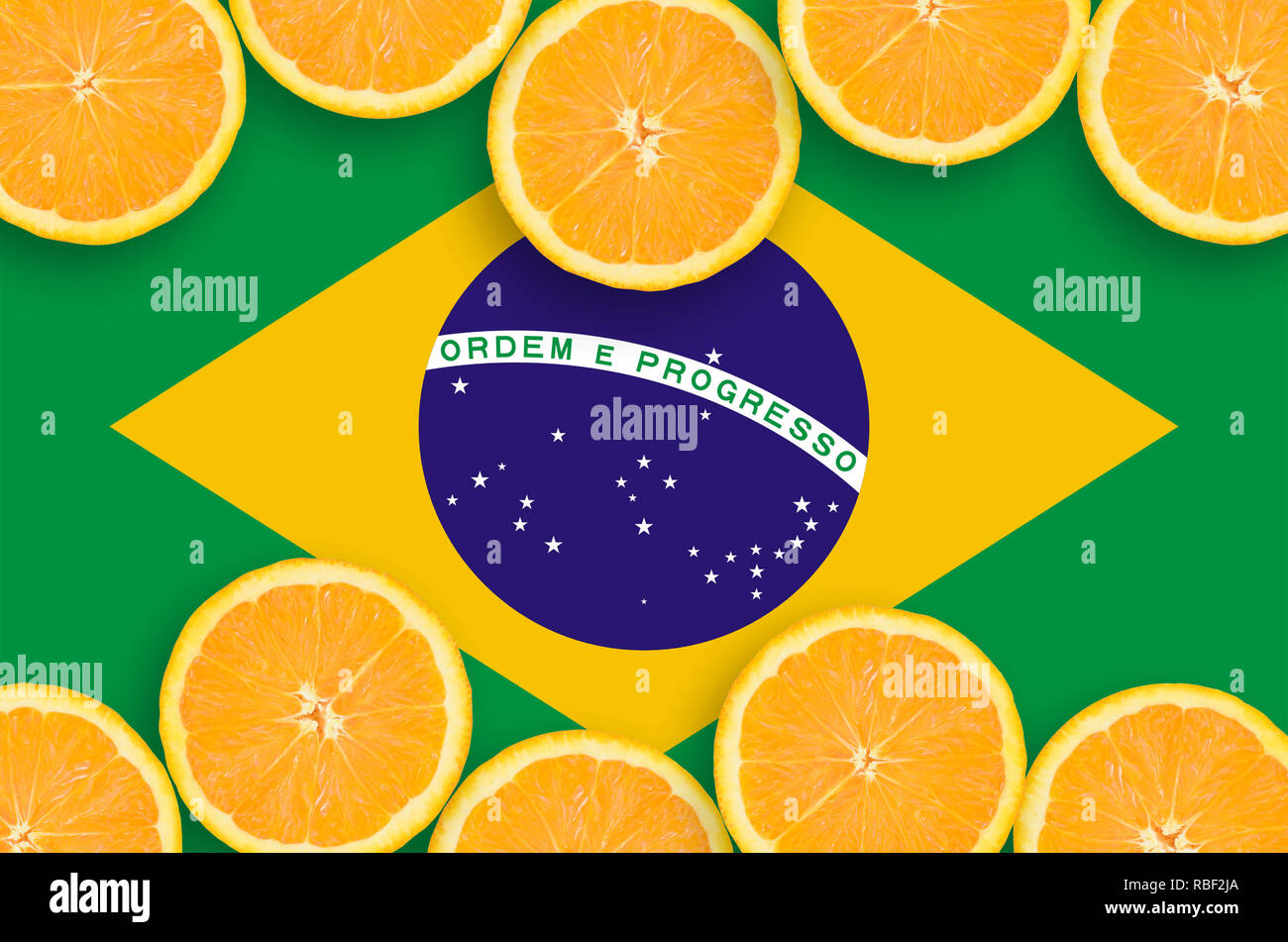 Brazil flag in horizontal frame of orange citrus fruit slices. Concept ...