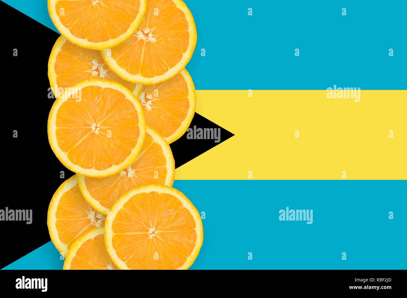 Bahamas flag and vertical row of orange citrus fruit slices. Concept of ...