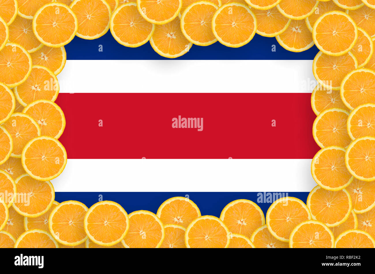 Costa Rica flag in frame of orange citrus fruit slices. Concept of ...