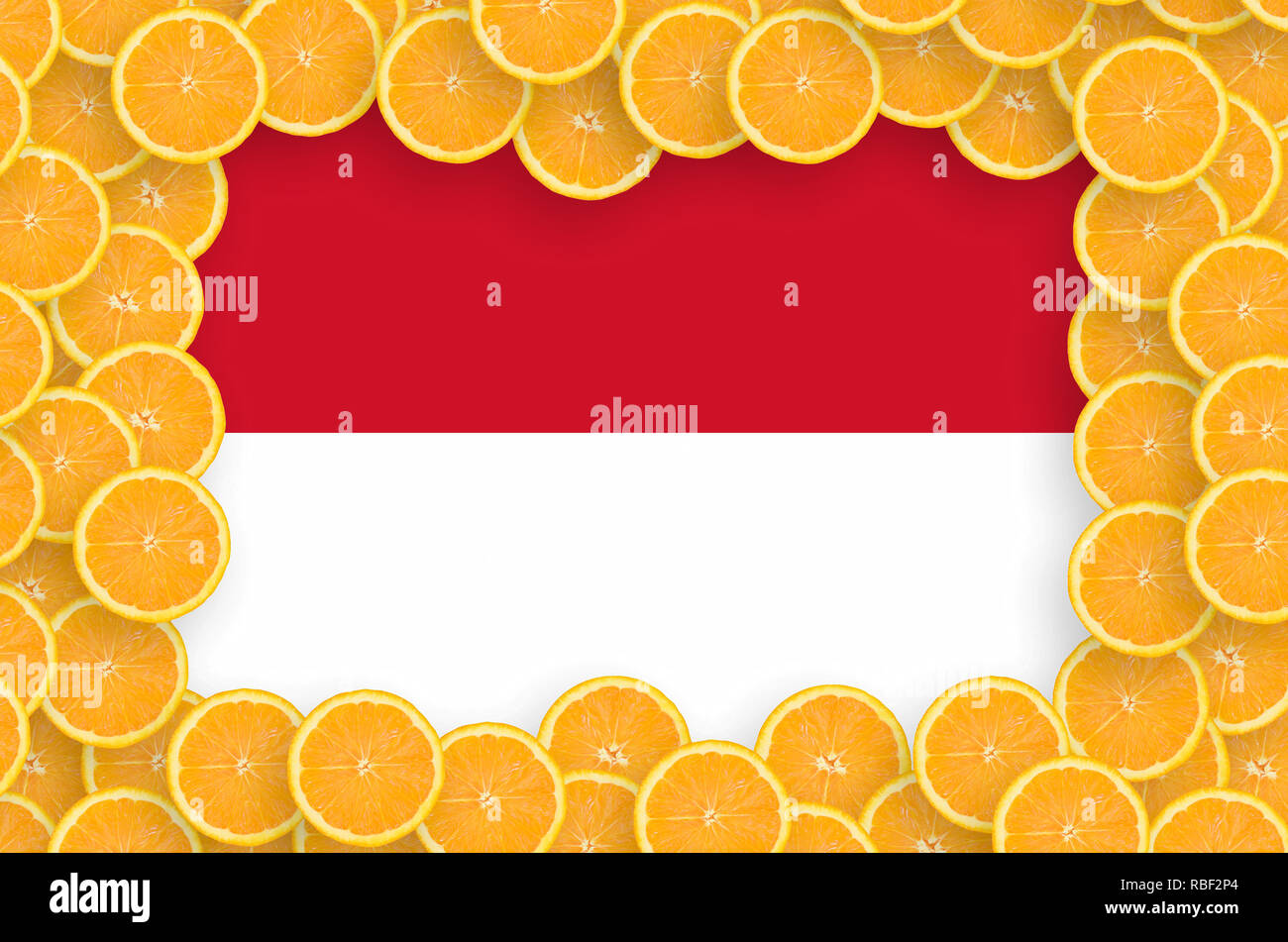 Monaco flag in frame of orange citrus fruit slices. Concept of growing ...